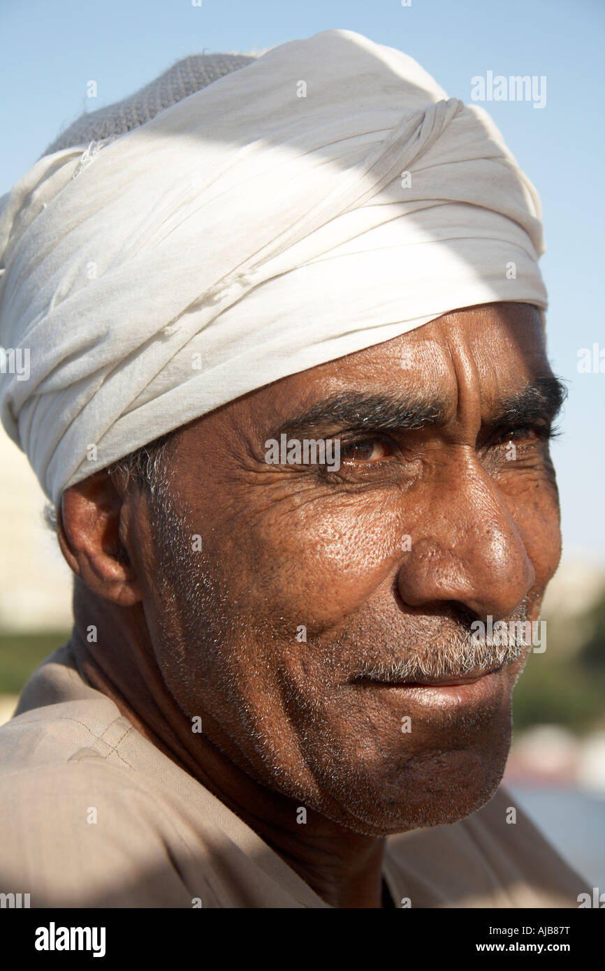 Egyptian boat man in traditional galibeya robe and turban Cairo Egypt ...