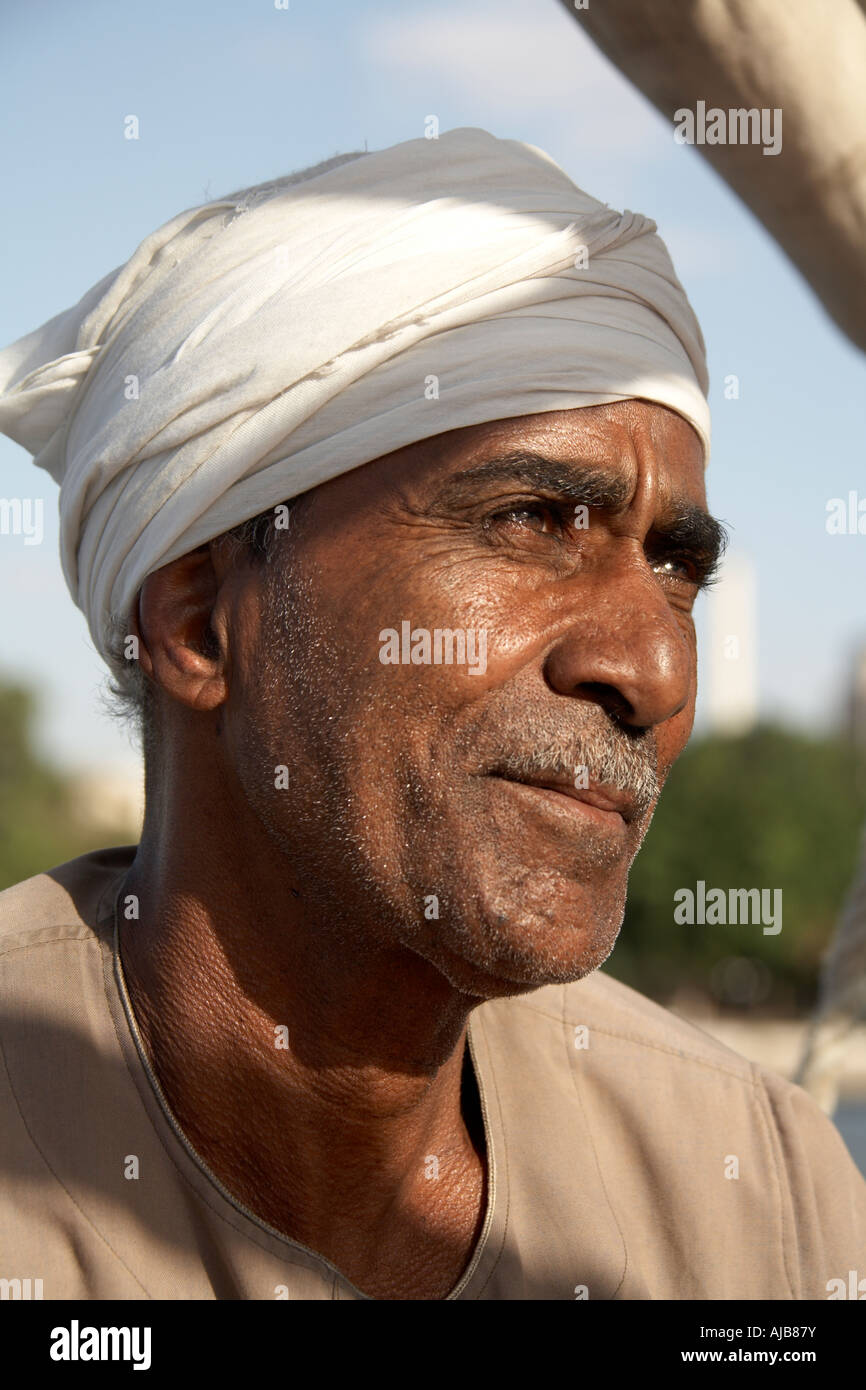 Egyptian boat man in traditional galibeya robe and turban Cairo Egypt ...