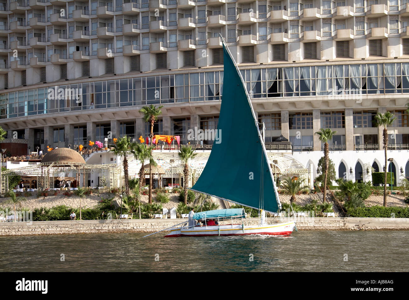 Grand Hyatt Hotel with felucca sailing boat on River Nile Cairo Egypt ...
