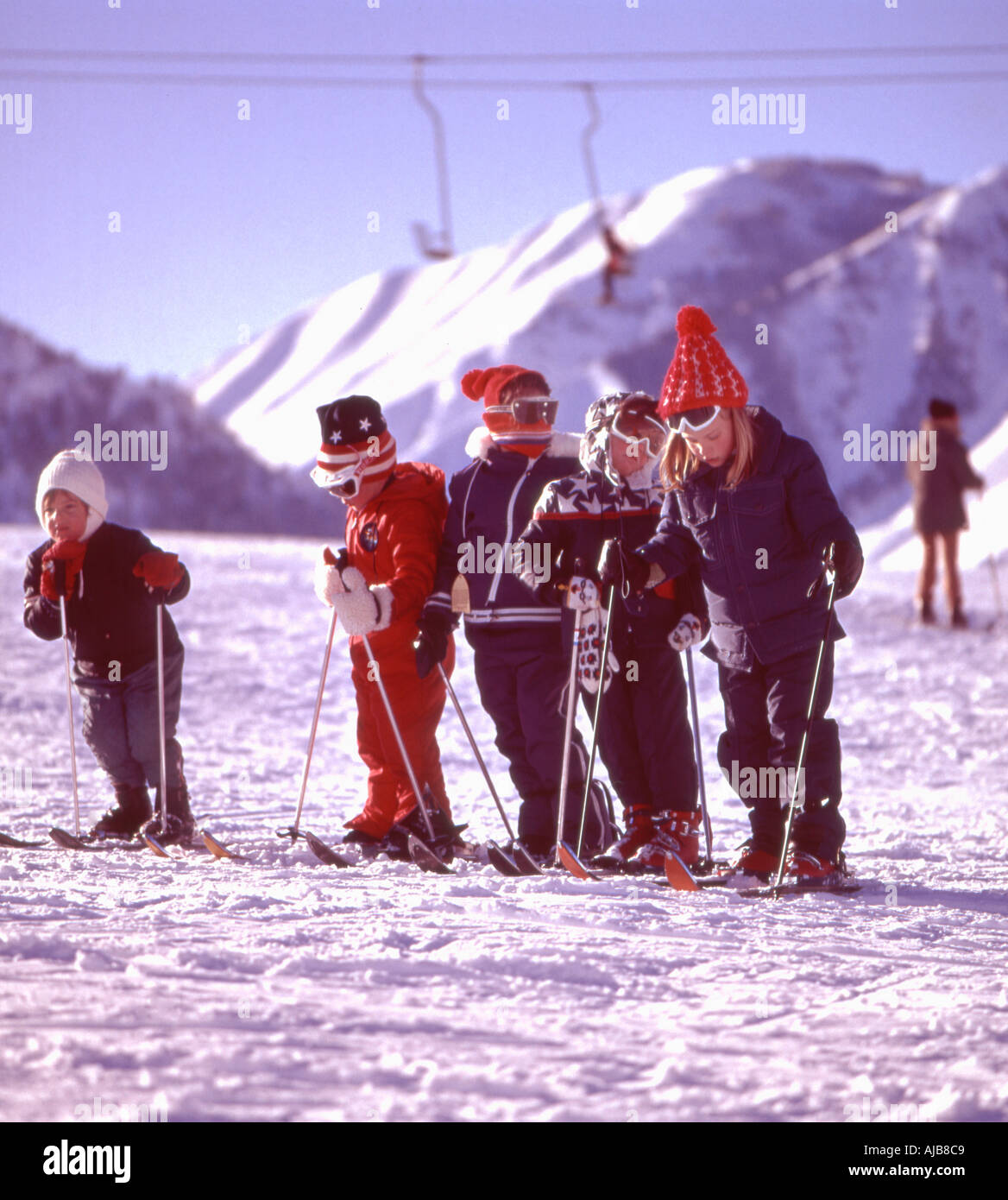 Kids ski class lines up for their lesson on a snowy resort slope Stock ...
