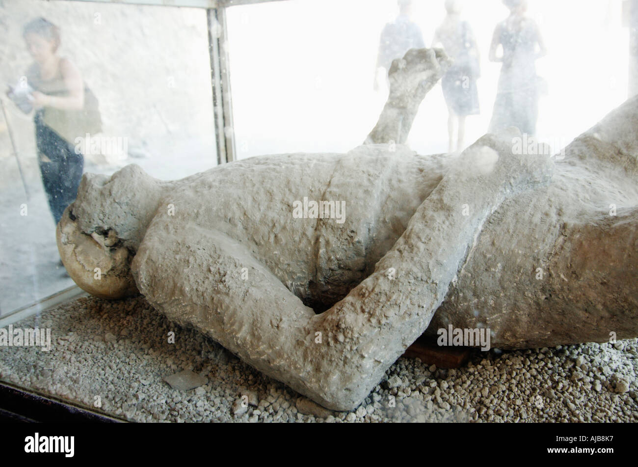 Plaster cast of victims in a show case at Pompeii Campania Italy under ...