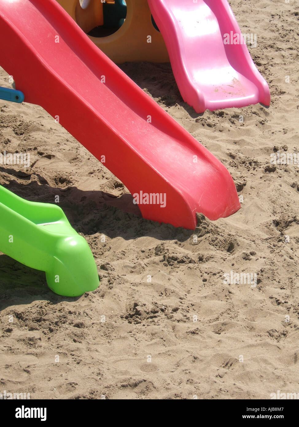 three slides in playground Stock Photo - Alamy