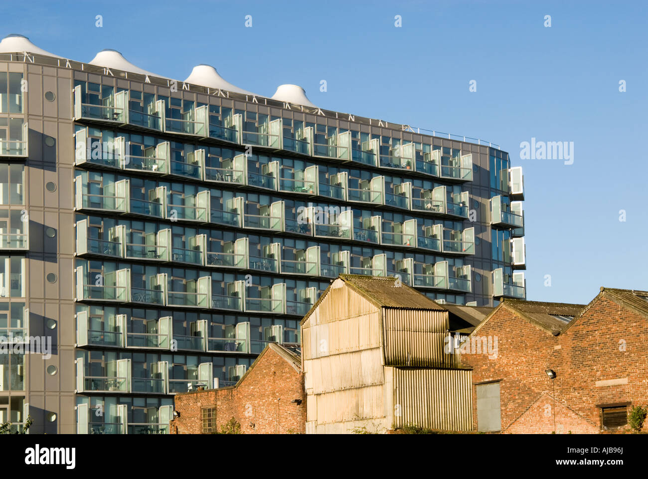 Modern Apartment Block and Old Warehouse Manchester UK Stock Photo - Alamy