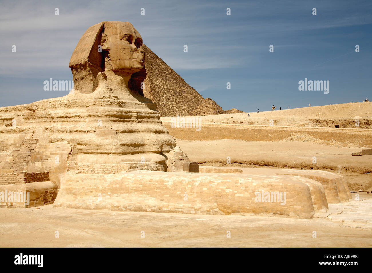 The Sphinx with Great Pyramid of Khufu Cheops in distance Giza Cairo ...
