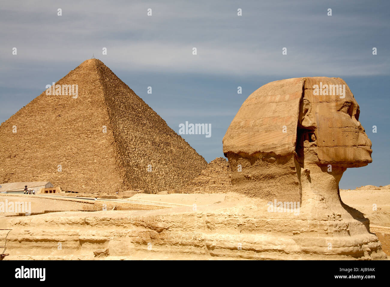 The Sphinx with Great Pyramid of Khufu Cheops in distance Giza Cairo ...