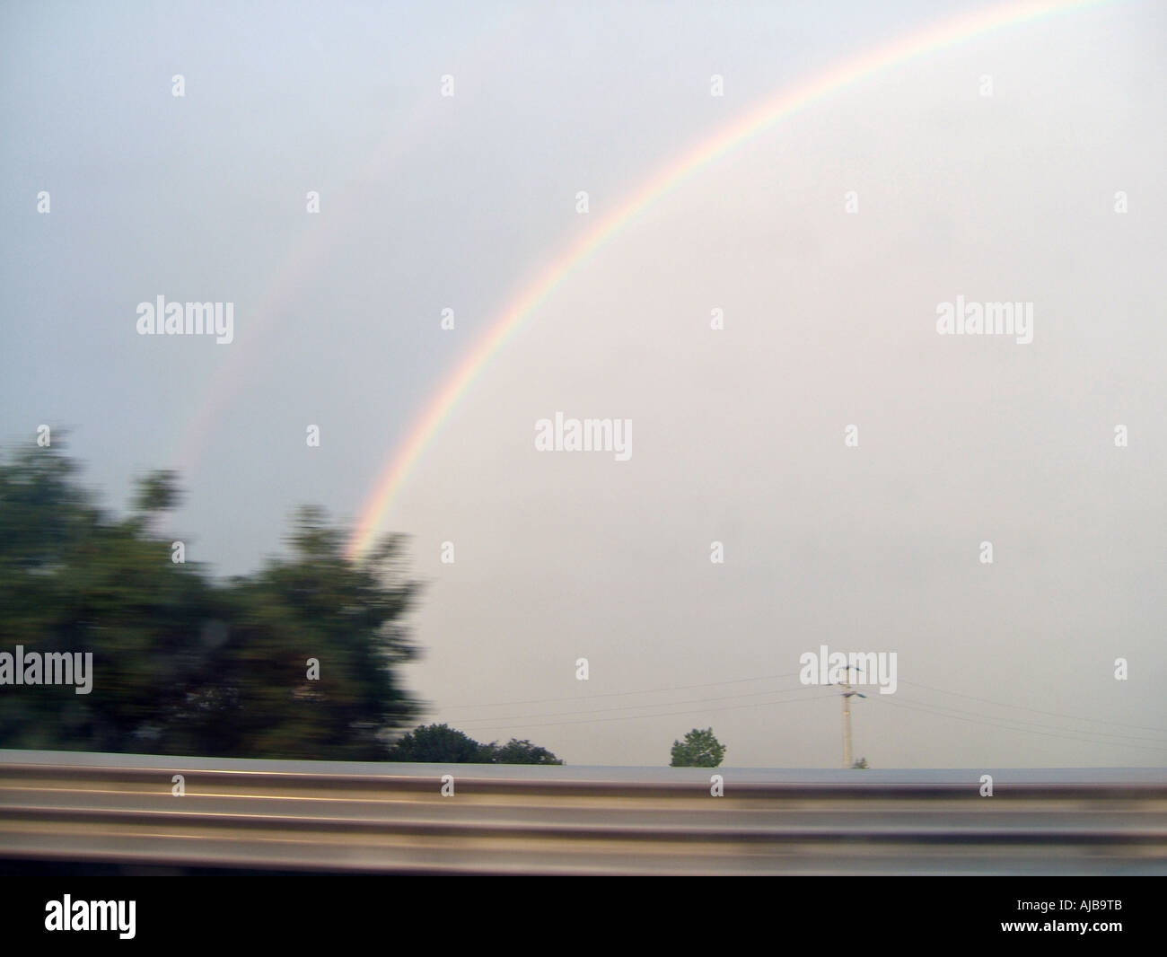 rainbow seen from moving vehicle Stock Photo - Alamy