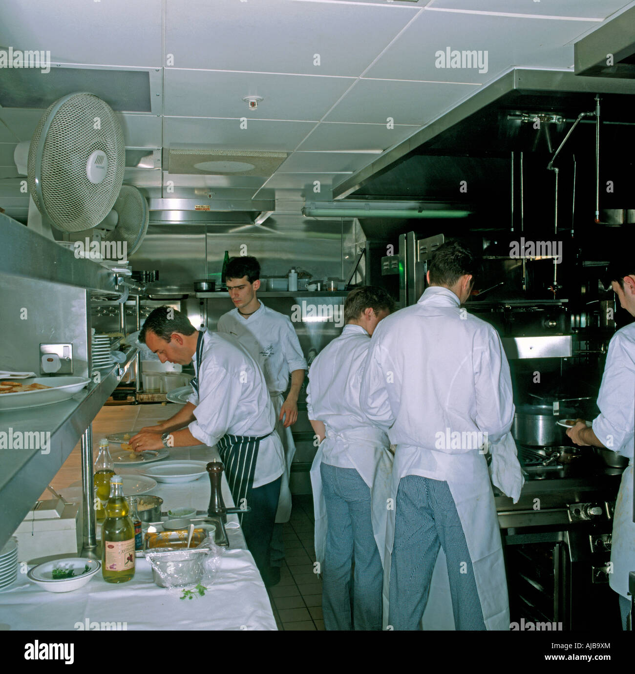 Chefs working on food preparation in 101 restaurant of Sheraton Park ...