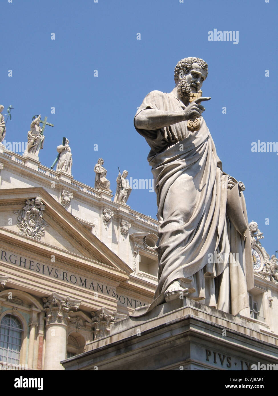 st peter statue and basilica facade in st peter's square, rome Stock ...