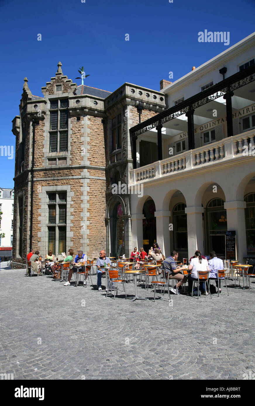 St Peter Port, A cafe in the refurbished Market Square Stock Photo - Alamy