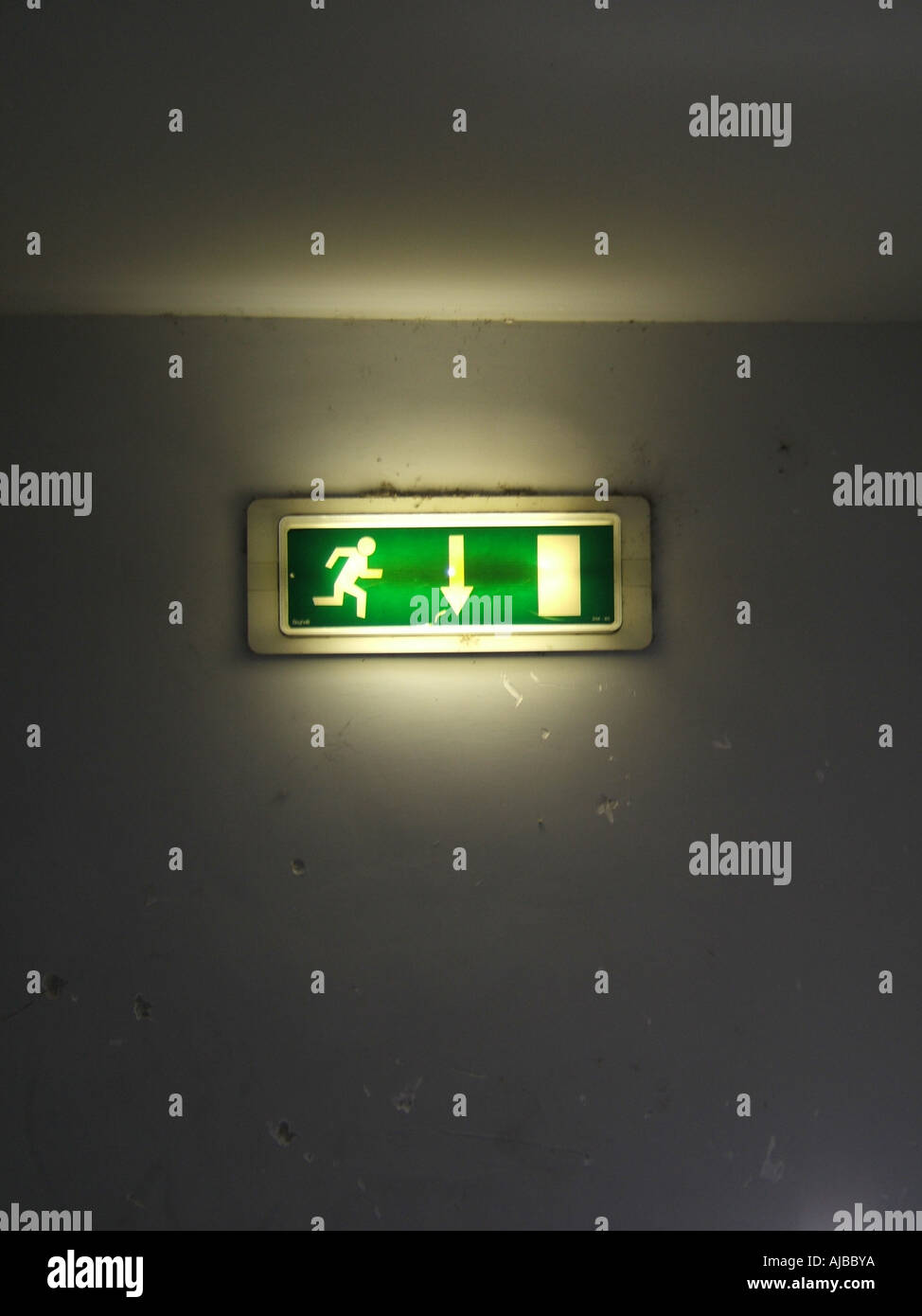 emergency exit sign in dark room Stock Photo - Alamy