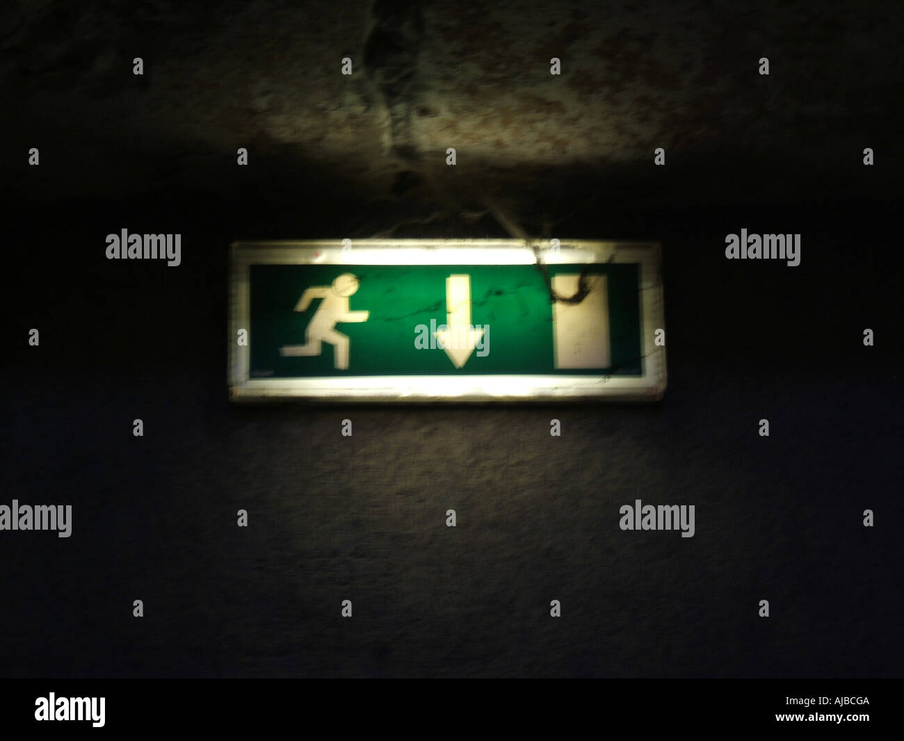 emergency exit sign in dark room Stock Photo - Alamy