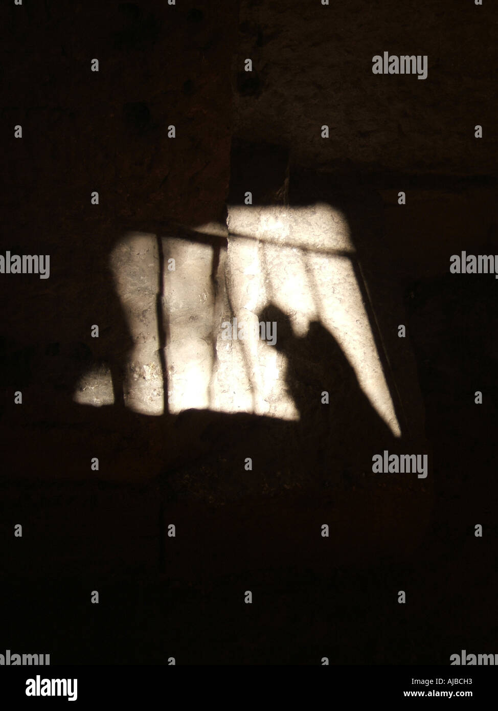 man's shadow on window with bars Stock Photo - Alamy