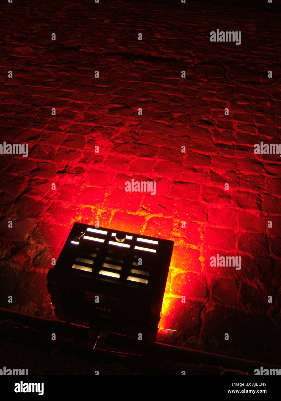 one warm orange spotlight at night Stock Photo - Alamy
