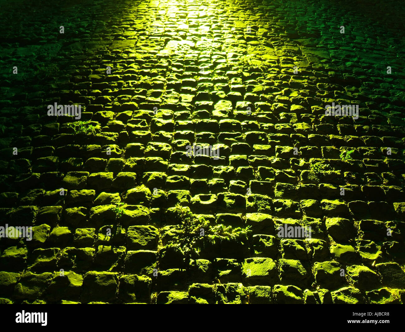 light beam on cobble stones at night Stock Photo - Alamy