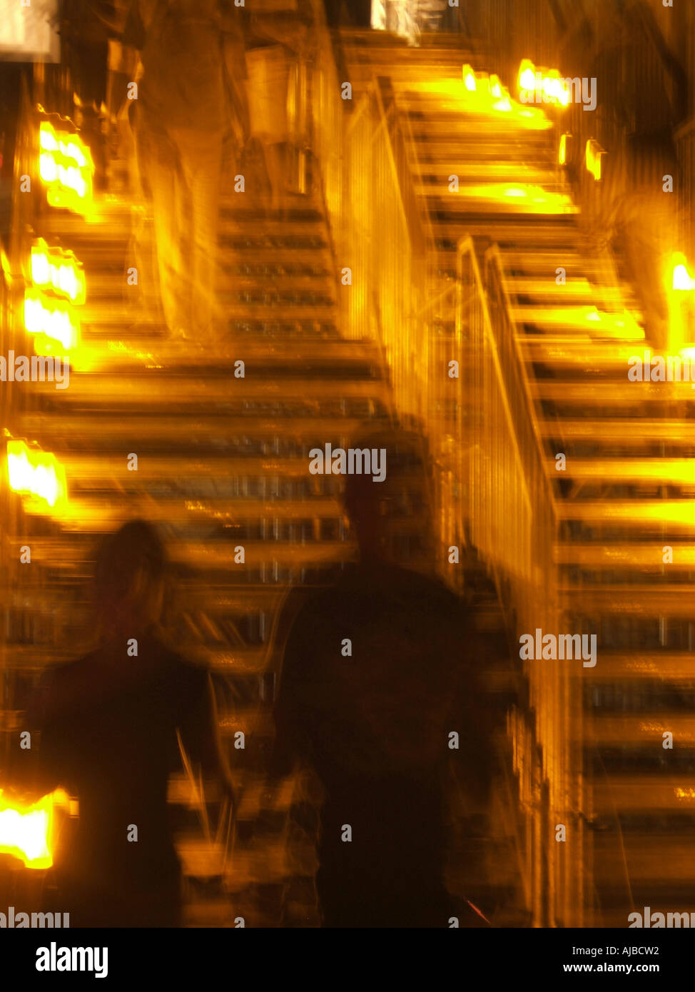 crowd of people walking up steps at night Stock Photo - Alamy