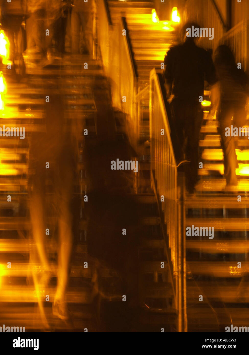 crowd of people walking up steps at night Stock Photo - Alamy