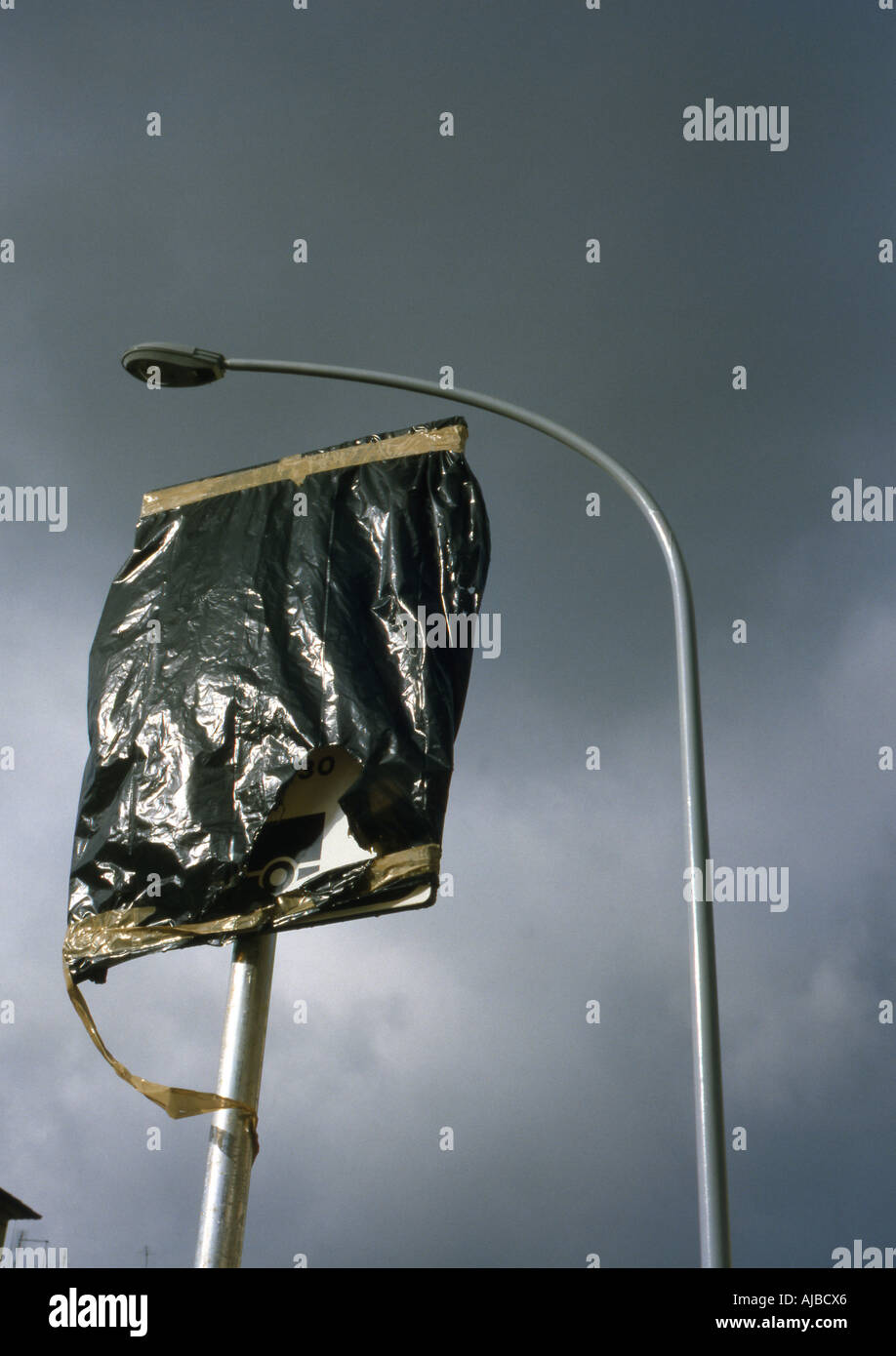 road sign covered with plastic bag Stock Photo - Alamy