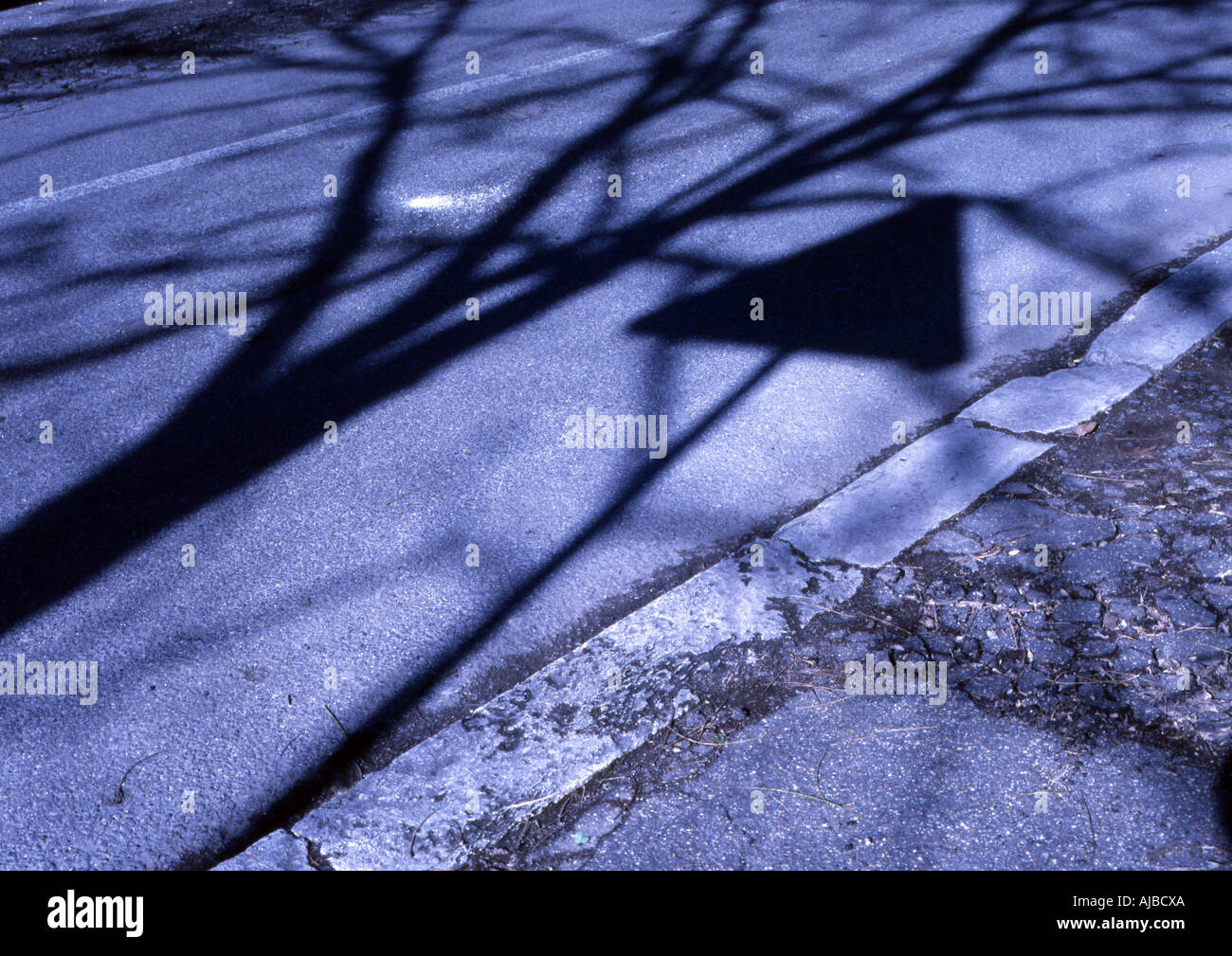 road traffic sign shadow on road Stock Photo - Alamy