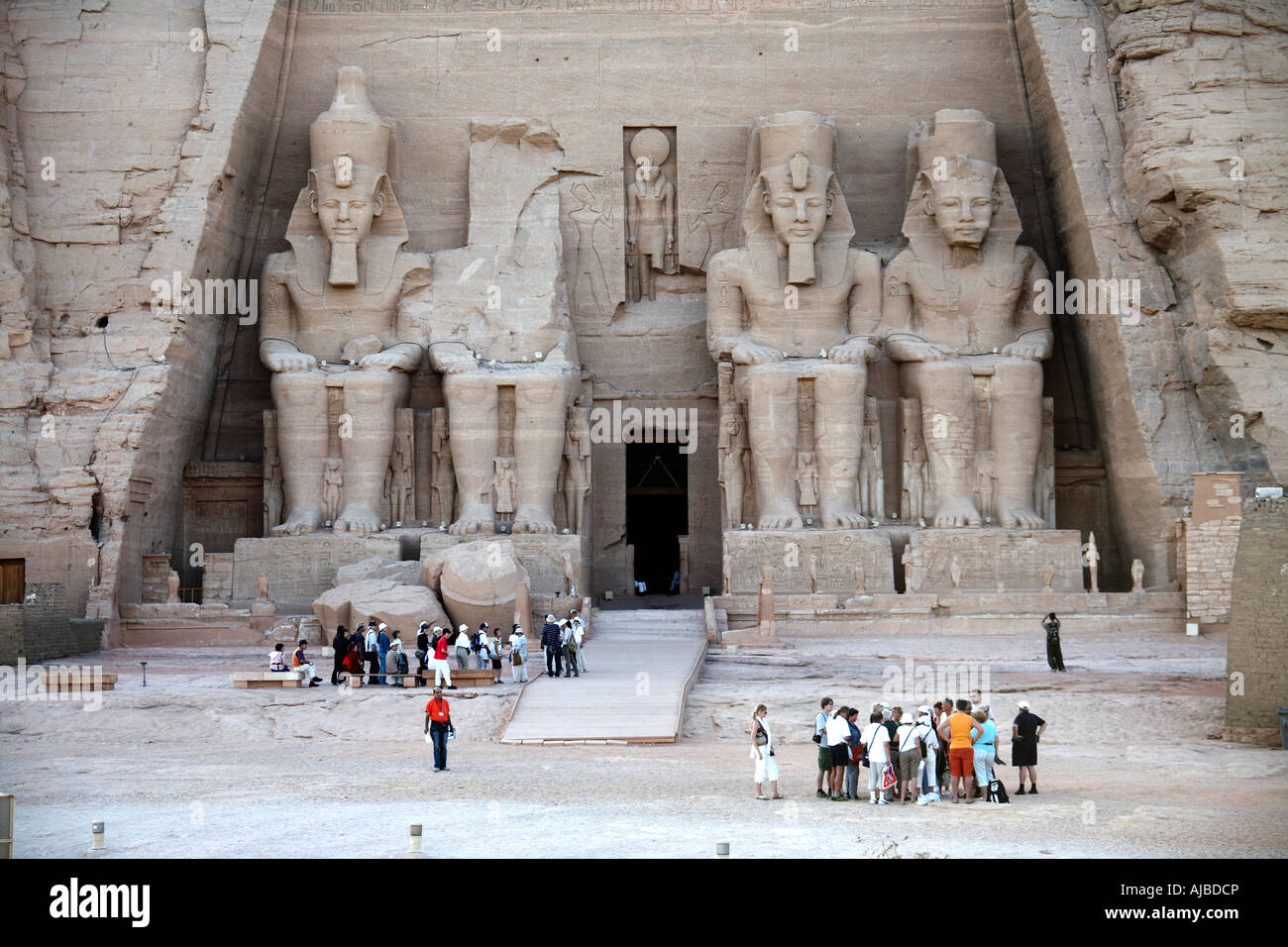 Giant carved statues of Ramses II outside the Temple of Abu Simbel ...