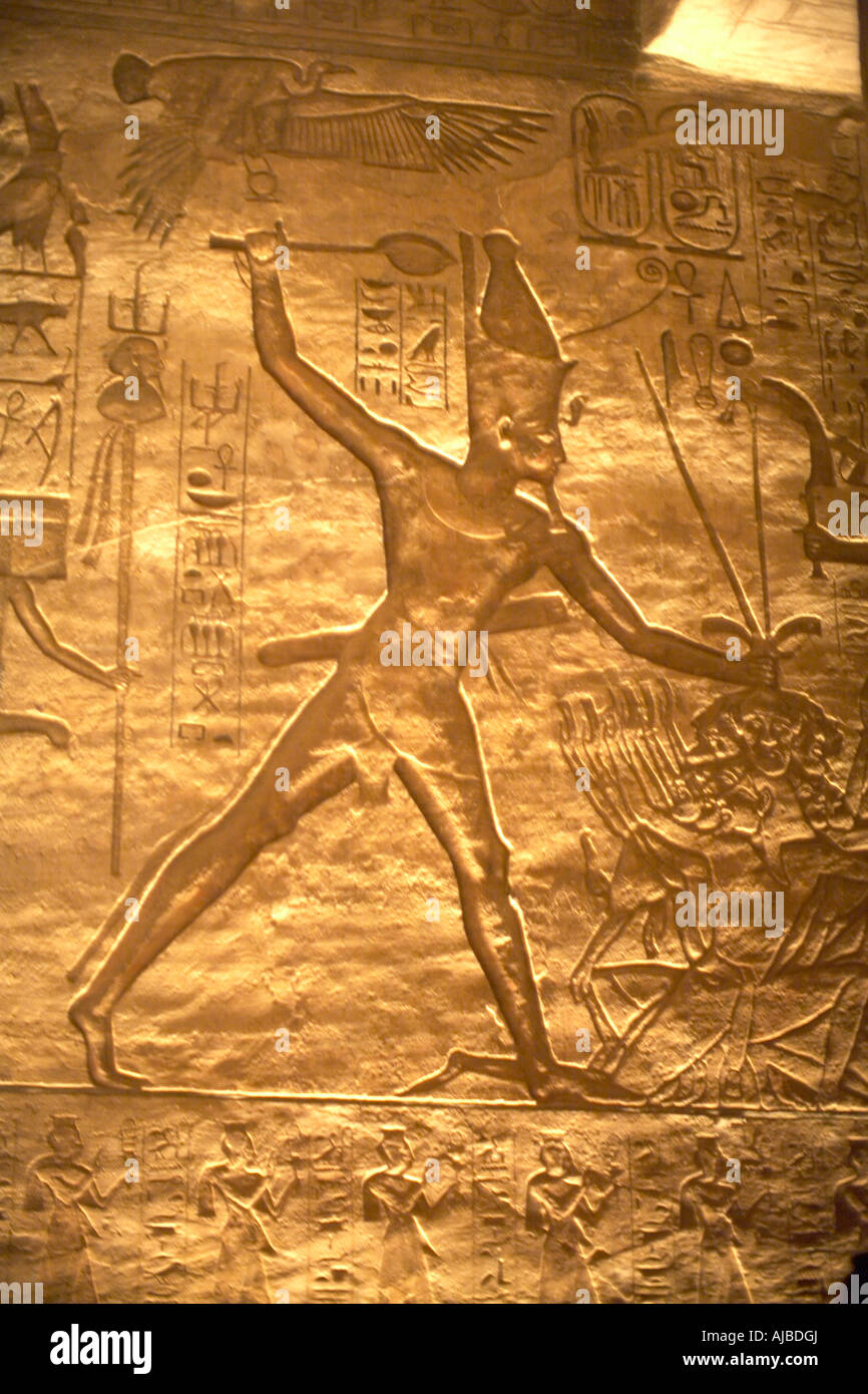 Wall relief carving of Ramses II killing his enemies from Syria in the ...