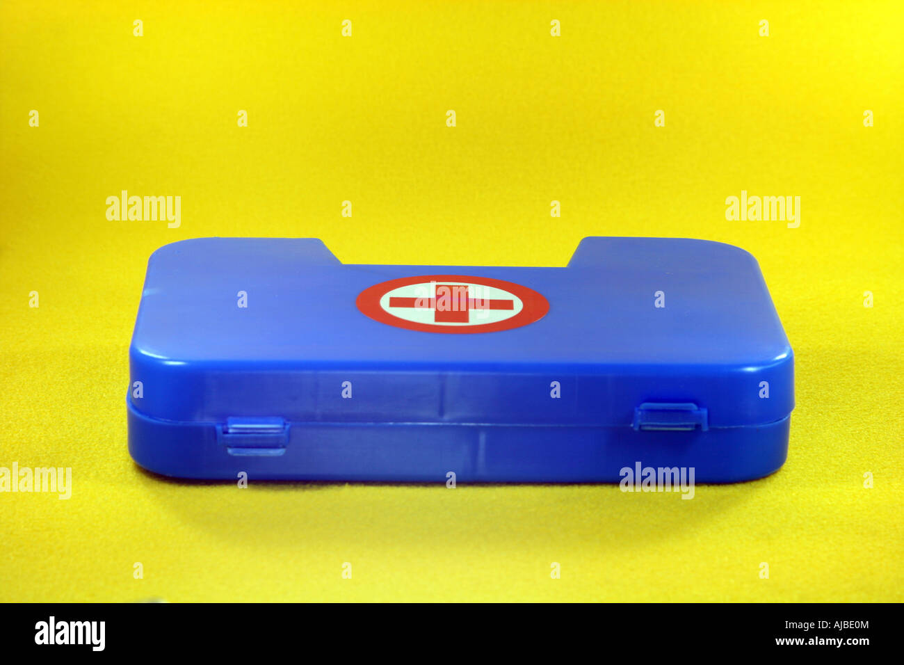 helth and safe concepts first aid box in yellow background Stock Photo ...