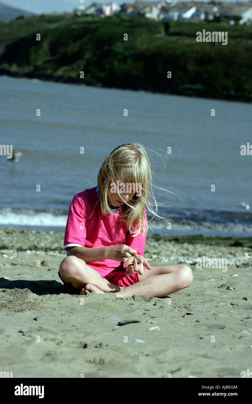 Girl playing with shells hi-res stock photography and images - Alamy