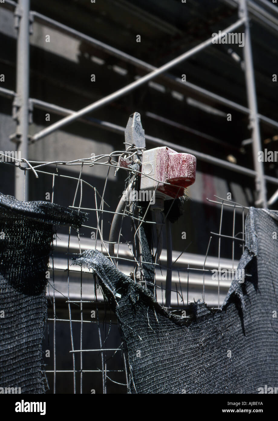 building site with scaffolding red warning light Stock Photo - Alamy