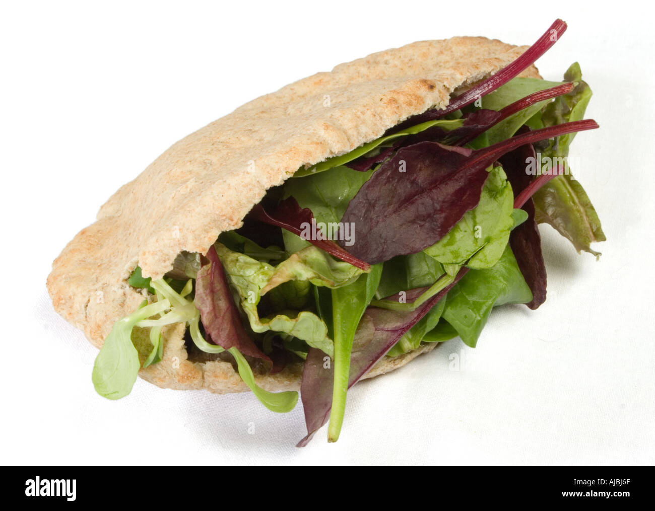 A wholemeal pitta bread filled with a leafy salad comprising Lambs ...