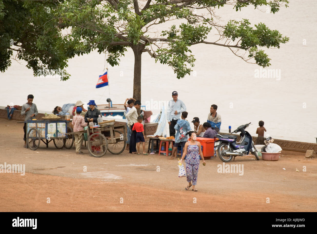 Cambodia Phnom Penh People Relaxing On The Sisowath Quay River Bank ...