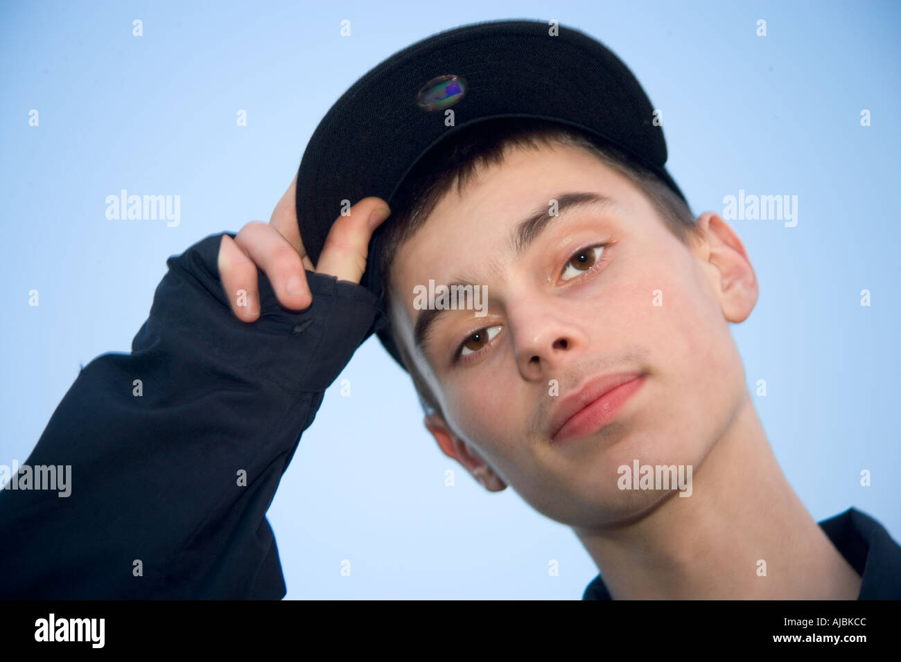 Portrait of young man wearing baseball cap Stock Photo - Alamy