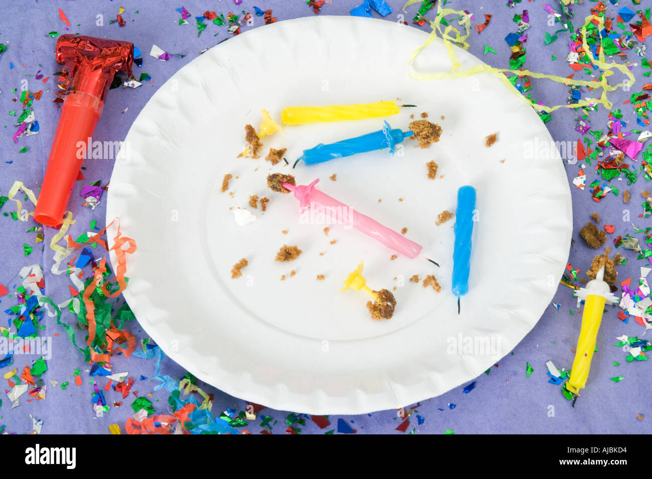 Birthday cake candles and paper plate Stock Photo - Alamy
