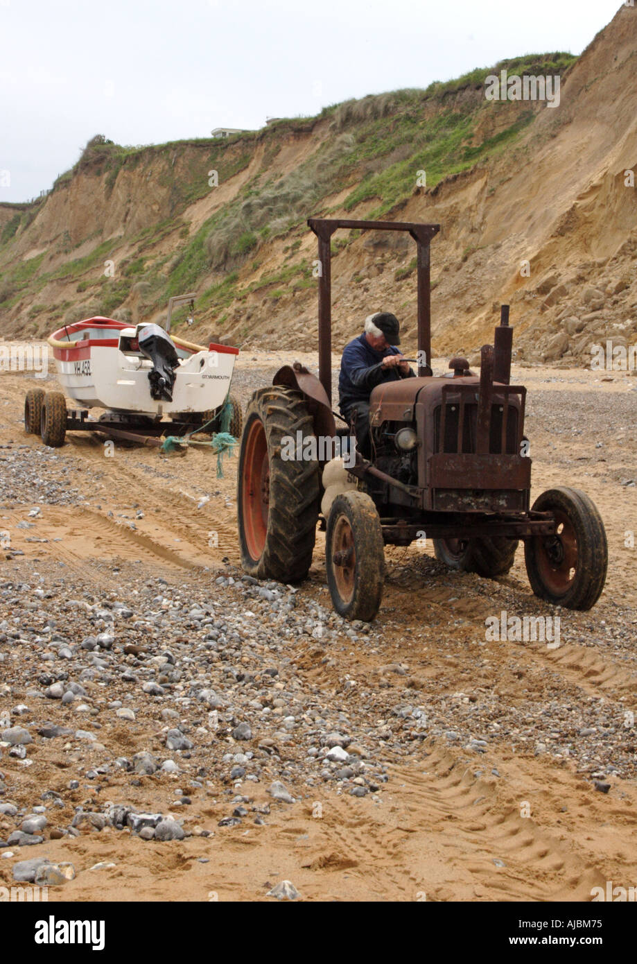 Pulling the boat in Stock Photo - Alamy