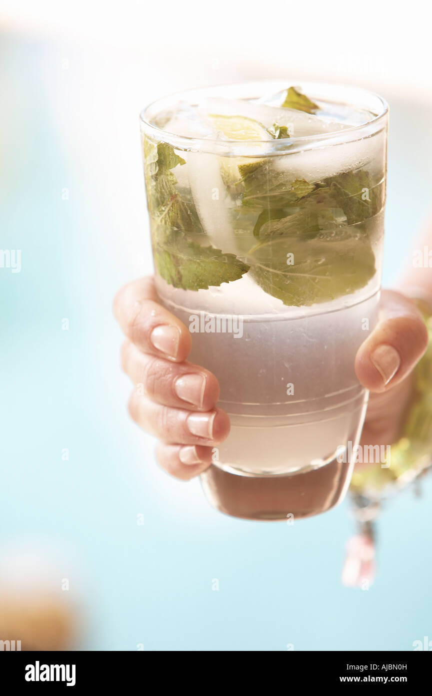 Close-up of Hand Holding a Glass of Mojito Stock Photo - Alamy