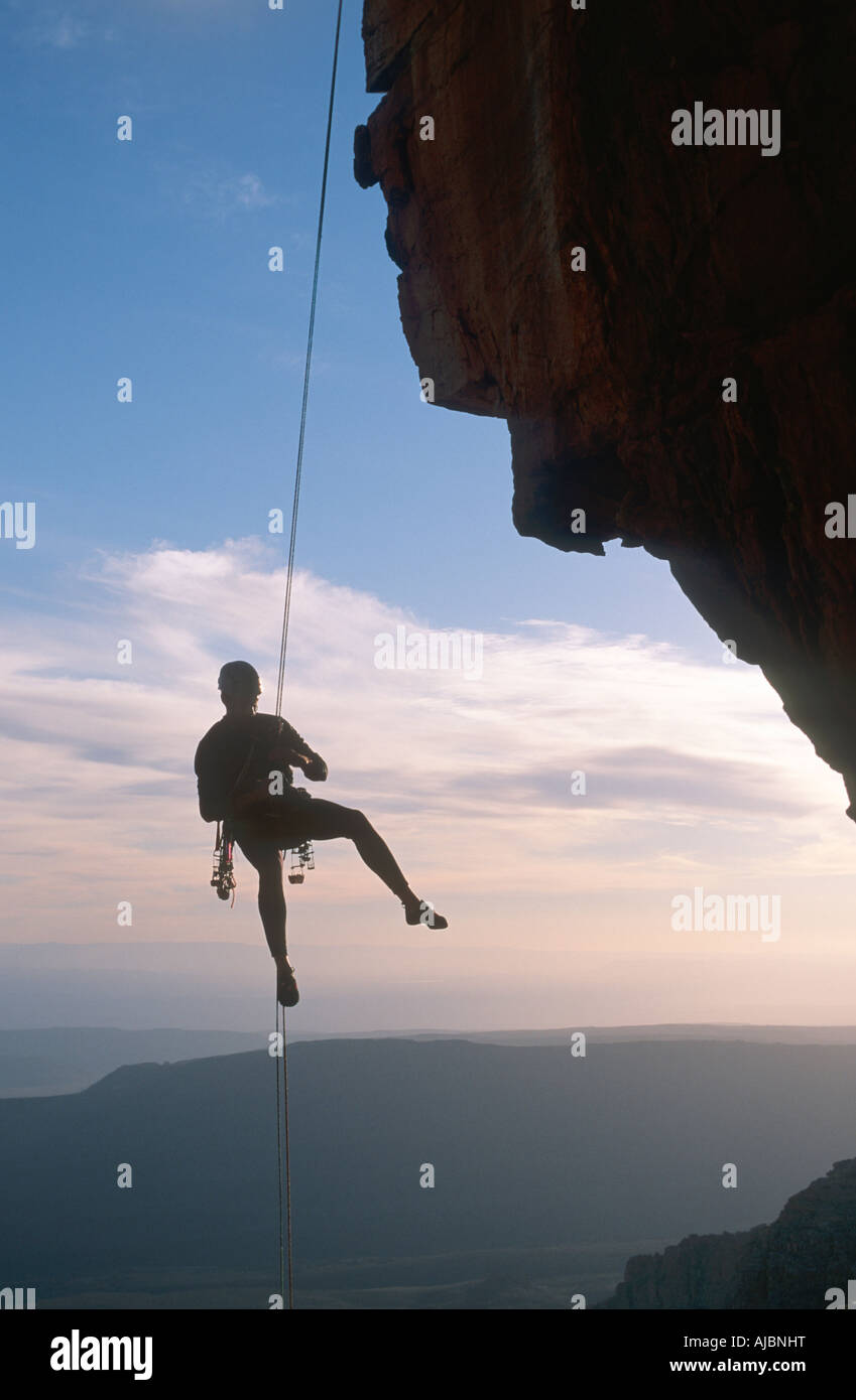 Man Abseiling Off Silhouetted Cliff Face in the Rocklands Cederberg ...