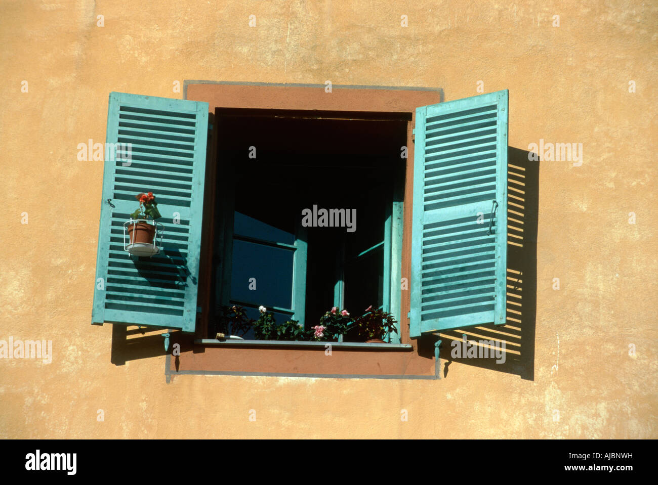 Ochre Wall and Turquoise Blue Window Shutters - Low Angle View Stock ...