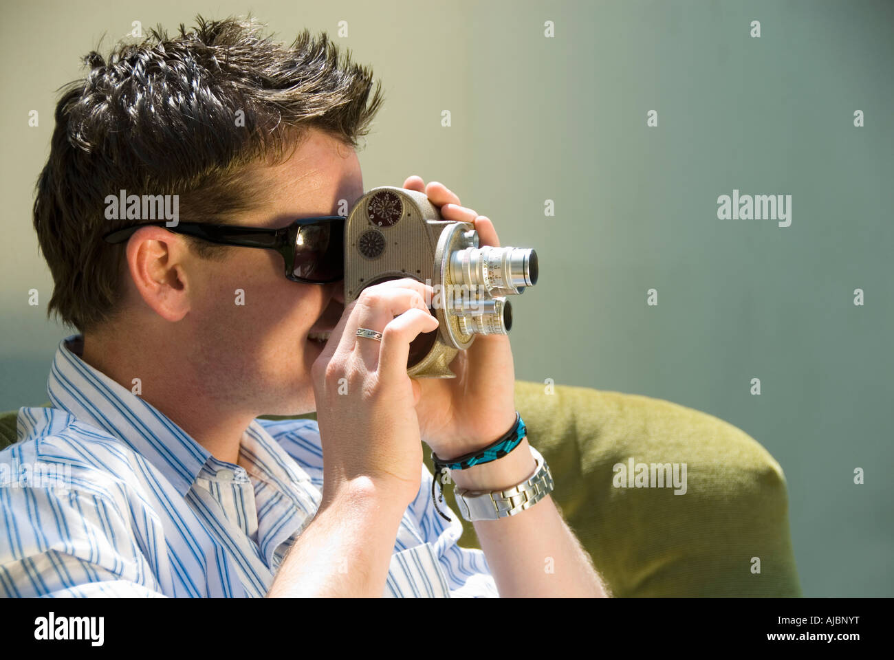 A Side View of a Young Man Looking Through Antique Camera Stock Photo ...