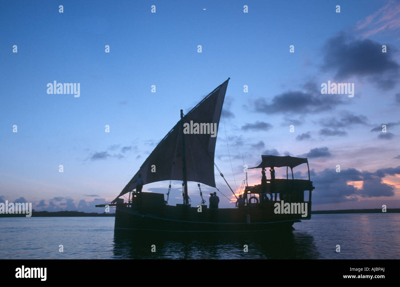 Silhouette of a Couple on a Dhow at Sunset Stock Photo - Alamy