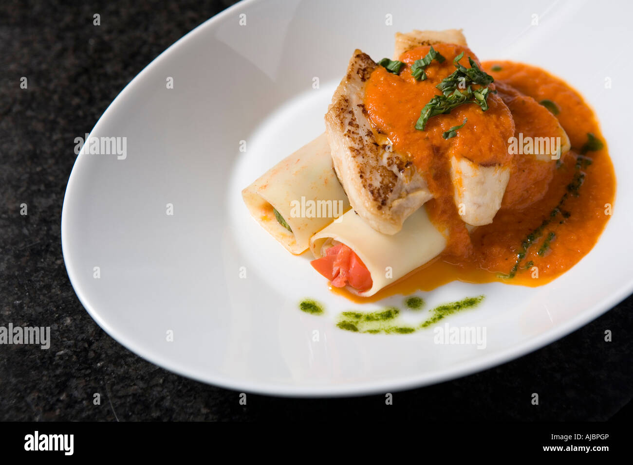 FISH CHERNE TOMATO CANNELLONI RATATOUILLE Stock Photo - Alamy