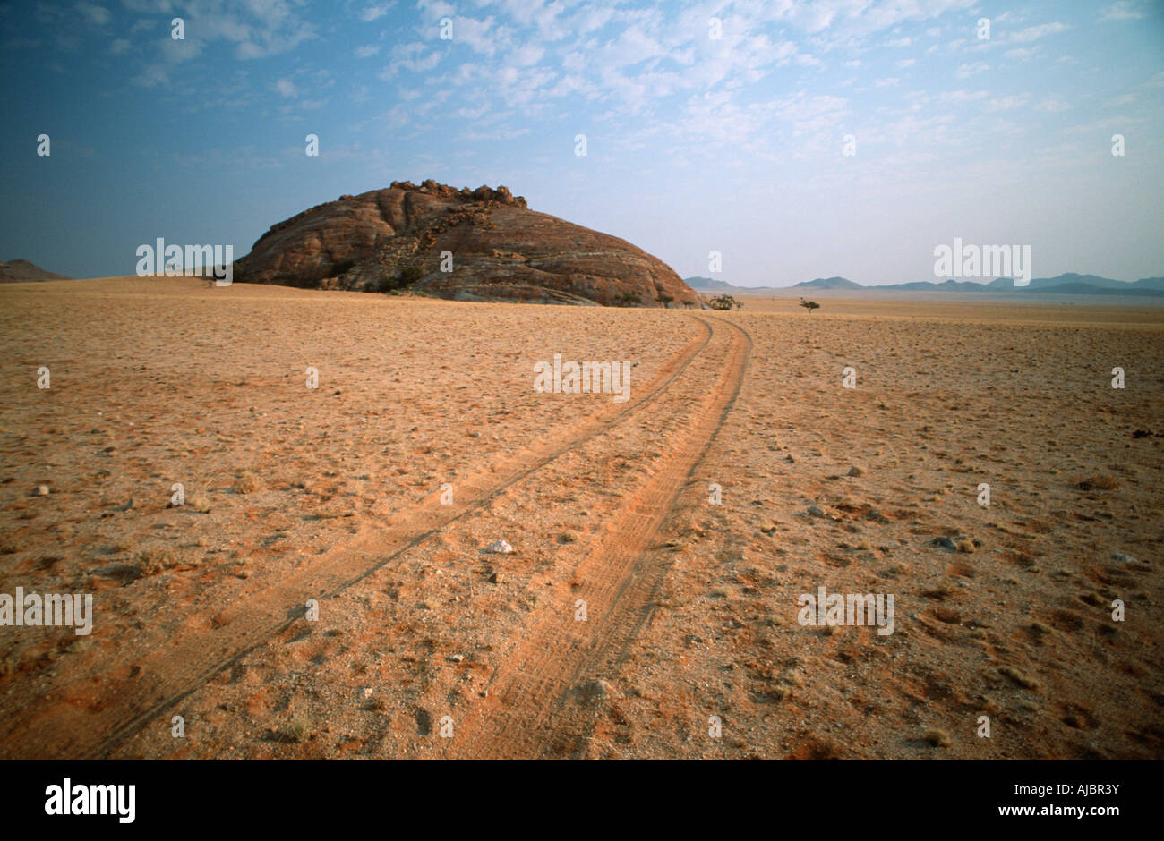 Tyre Tracks and a Rock Formation in the Desert Stock Photo - Alamy