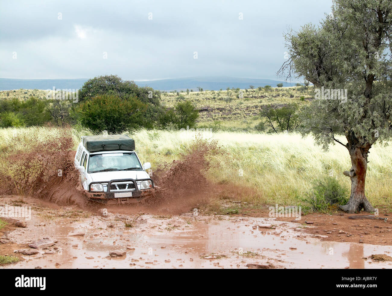 4x4 Vehicle Splashing Through Mud Stock Photo - Alamy
