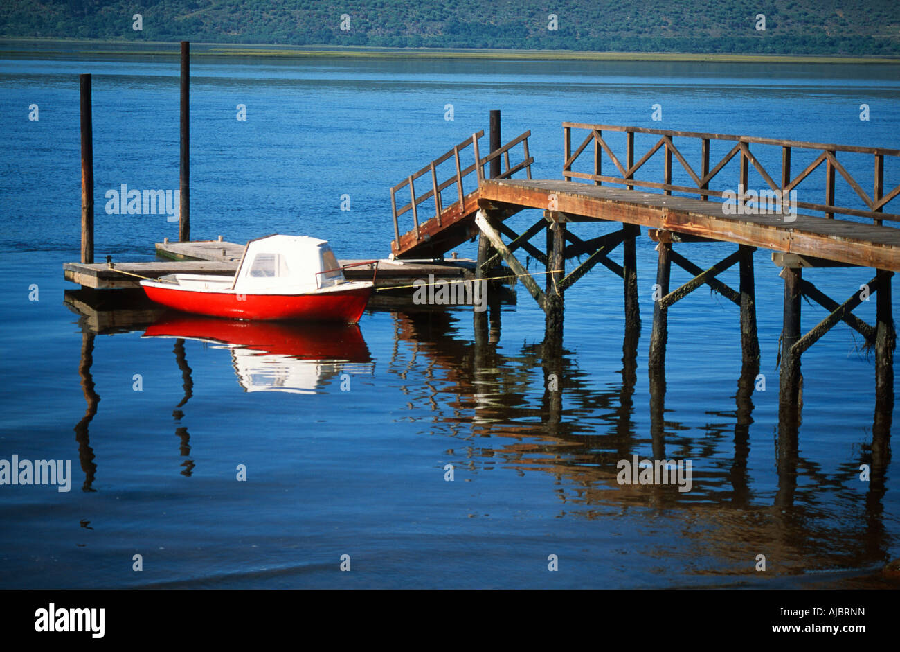 Small Boat and Jetty Stock Photo - Alamy