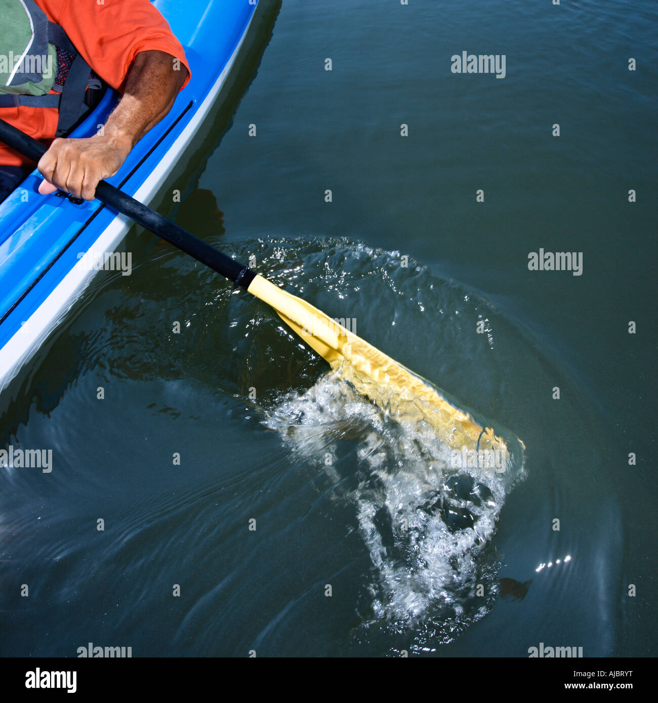African American male arm paddling kayak Stock Photo - Alamy