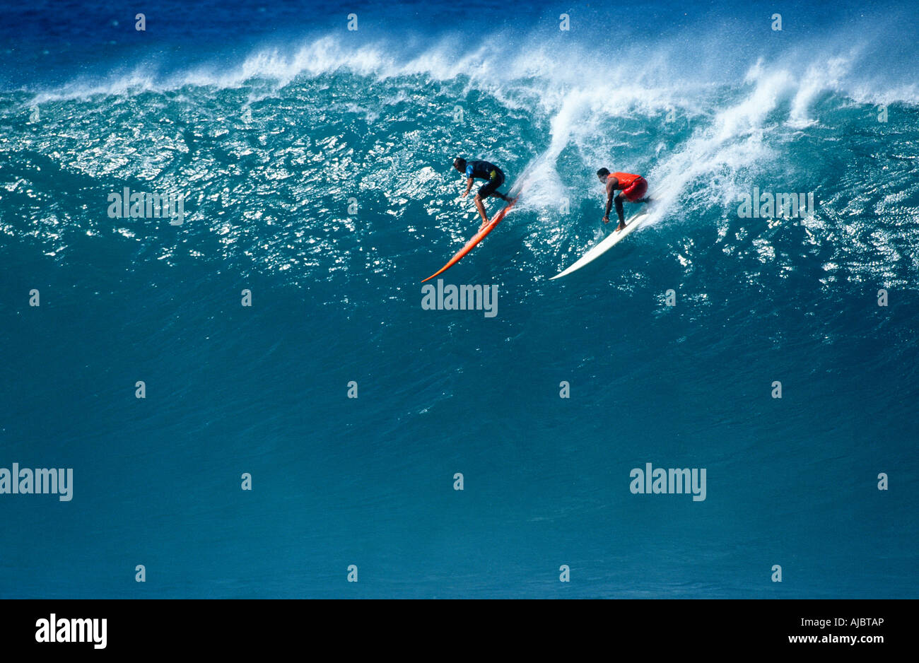Two Surfers Riding a Huge Wave Stock Photo - Alamy Two Surfers Riding a Huge Wave Stock Photo - Alamy