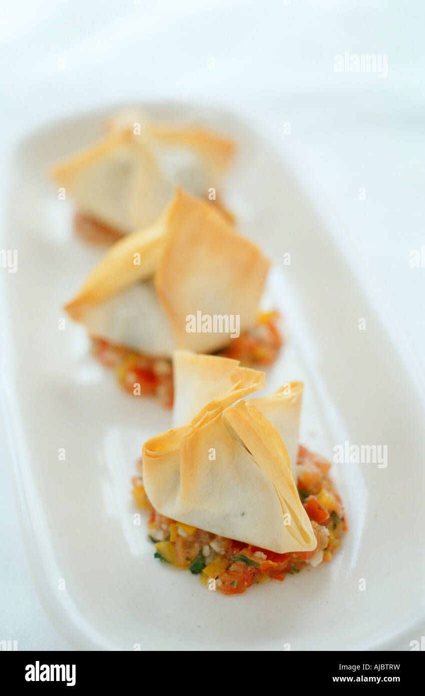 Snails in Phyllo with Cherry Tomato Relish Stock Photo - Alamy