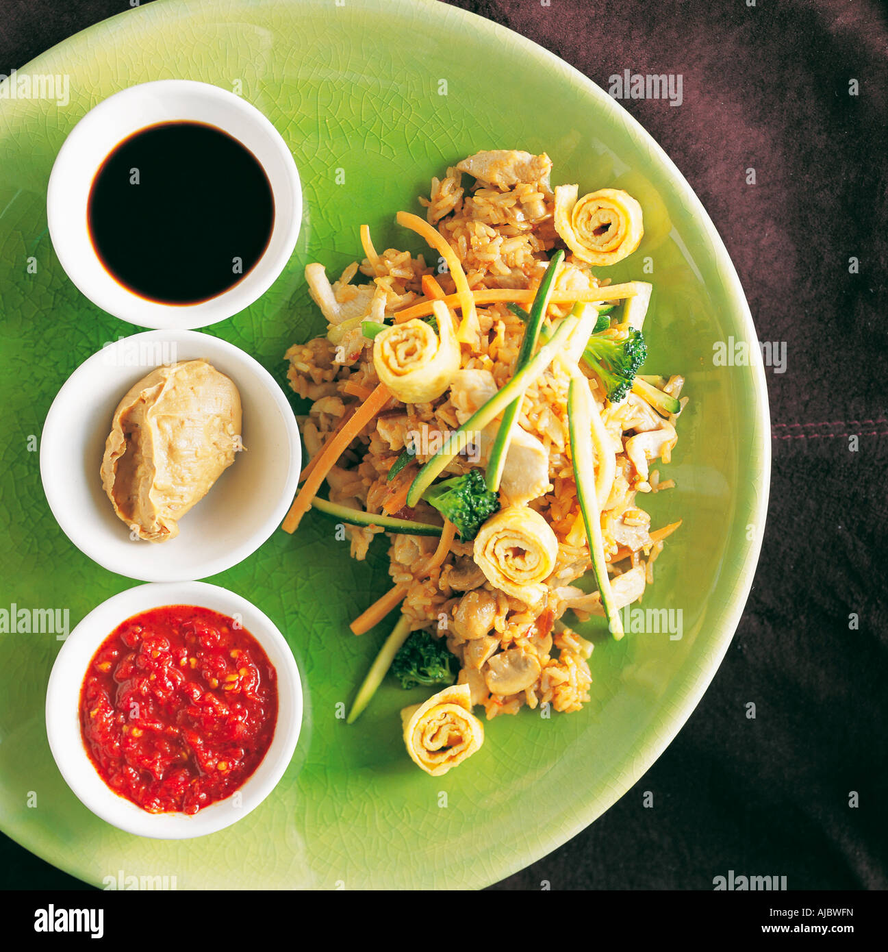 Nasi Goreng.Indonesian Rice Dish traditionally served with a peanut ...