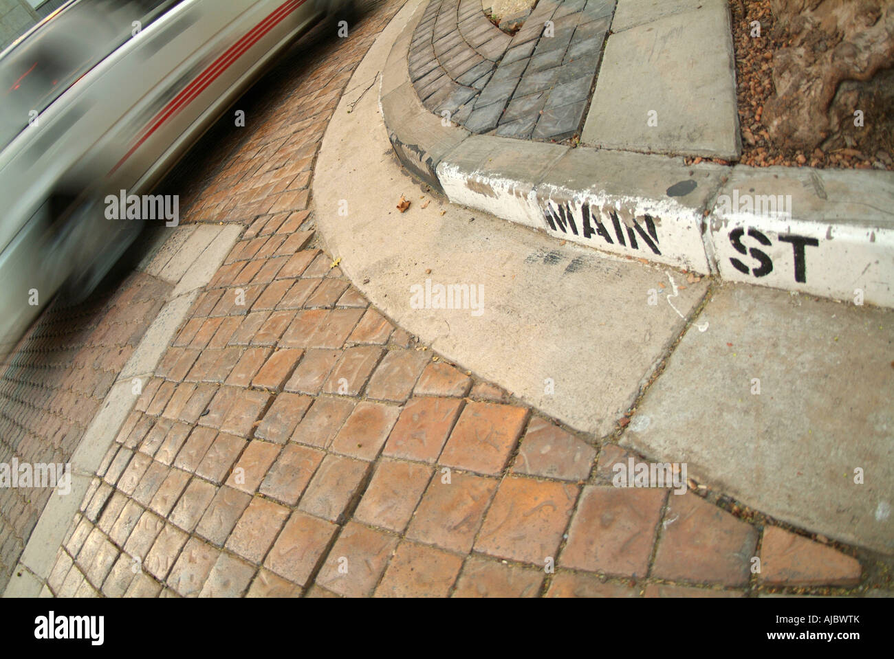 Close Up of a Street Corner with Car Driving By Stock Photo - Alamy