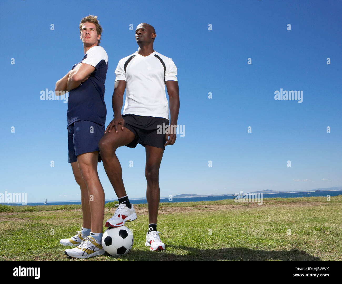 Two men standing side by side hi-res stock photography and images - Alamy