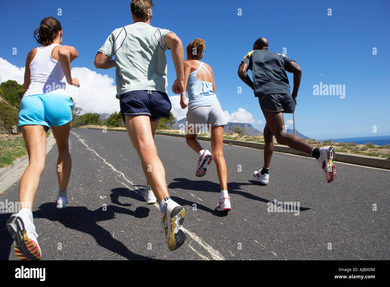 Low Angle View of Athletes Running Uphill Stock Photo - Alamy