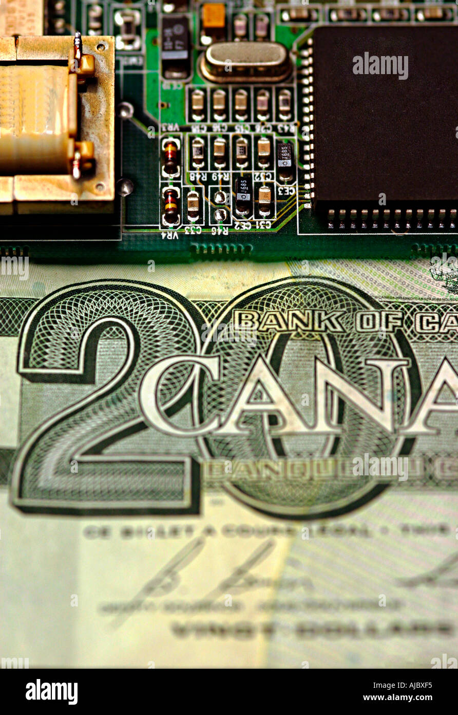Concept Photo of Canadian Money and Computer Circuit which symbolises ...