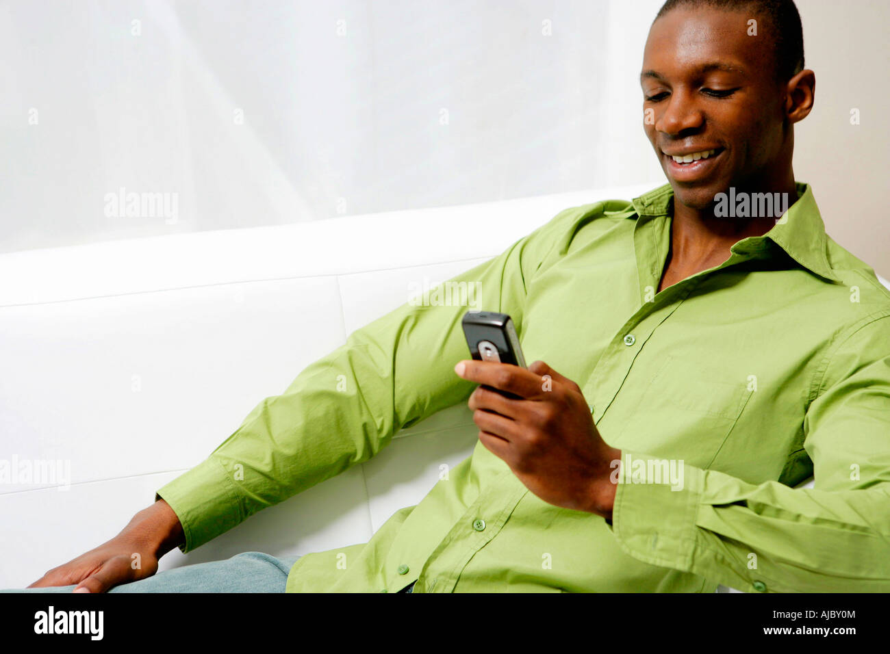 African Man Holding a Mobile Phone Stock Photo - Alamy